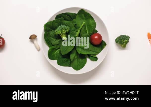 Fresh vegetables entering the plate and than they are cooked. Stop ...