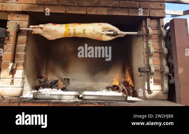 Spit Roasted Lambs, traditional way of roasting lambs on a rotisserie ...