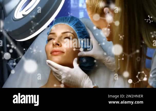 Animation of white molecules floating over ca female patient having her ...