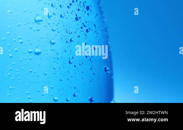 Condensate formation process, close shot. Condensation on bottle of ...