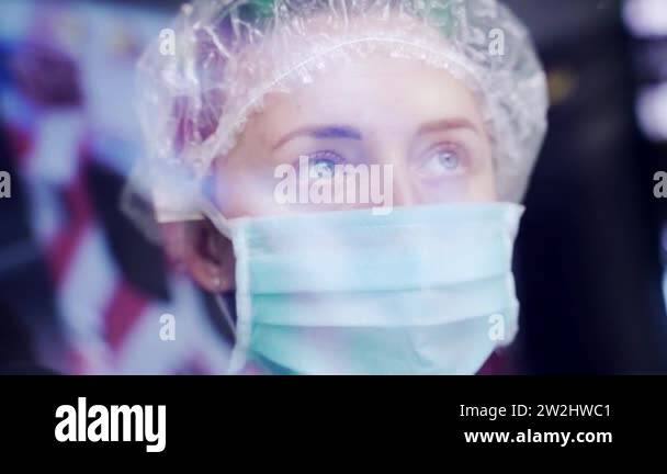 female doctor or nurse in protective medical mask. In special clothing ...