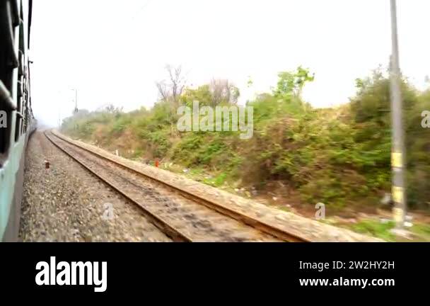 Indian Railways. Passenger train, by rail. Shot from window of last car ...