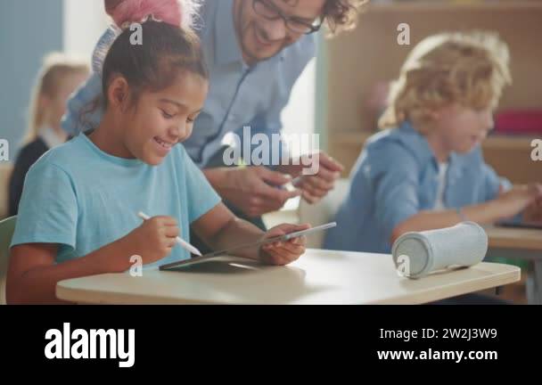 Elementary School Computer Science Class: Smart Girl Uses Digital ...