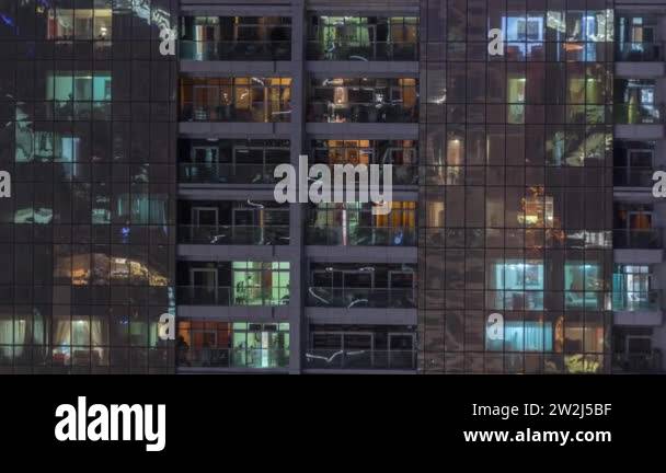 Night view of exterior apartment building timelapse. High rise ...