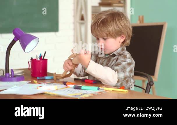 Education first. Pupil in Classroom. Elementary school kids in ...