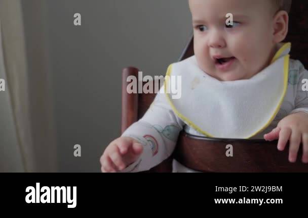 first feeding, food, nutrition, childhood concepts - Mom feeds infant ...