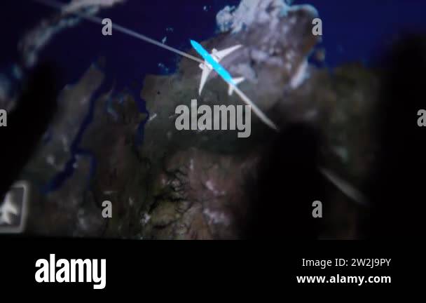 4K Woman using touchscreen flight information map on a passenger cabin ...