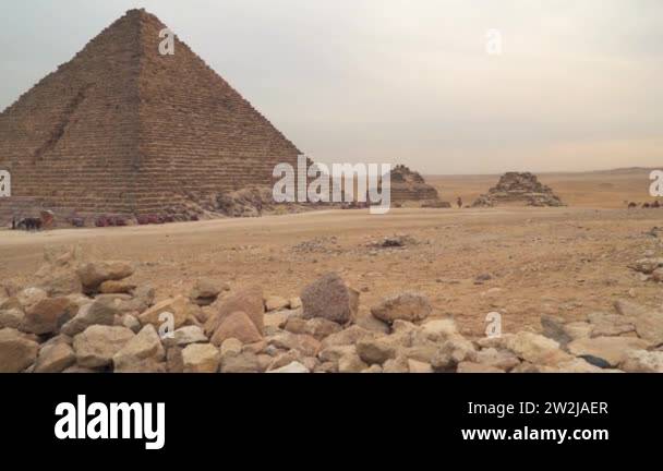 Pyramid of Pharaoh Menkaure and the Pyramid of the queens. Camels near ...