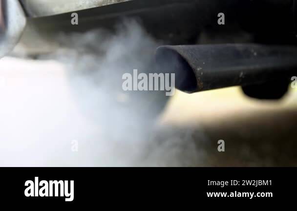 4K, Close-up combustion fumes coming out of car exhaust pipe which ...