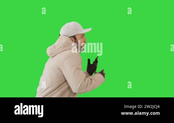 Hip-hop man singing rap, walking and making gestures on a Green Screen ...