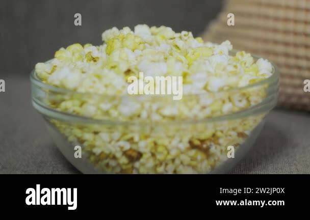 Female hand picking popcorn from paper bucket closeup. Close up of ...