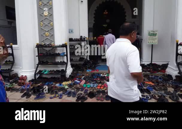George Town, Penang/Malaysia-Jun 01 2018: Muslim take off the shoes ...