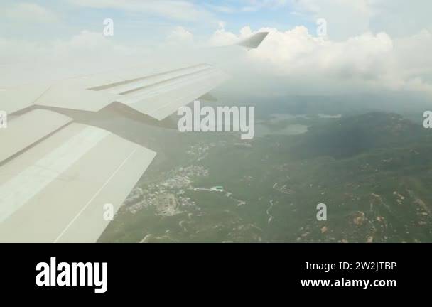 Aircraft Fly Down with turbulences, Ground Under Wing Of An Airplane go ...