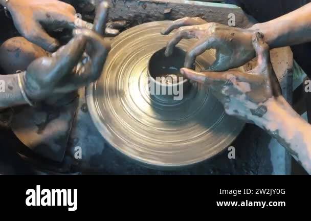 Hands Smooths A Piece Of Clay / 4K Pottery artist making a shape from ...