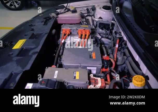 Close up detailed view of electric car engine in factory. Electric ...