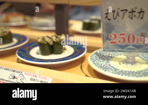 Sushi rail restaurant with rotating Japanese food plates in 4k Stock ...