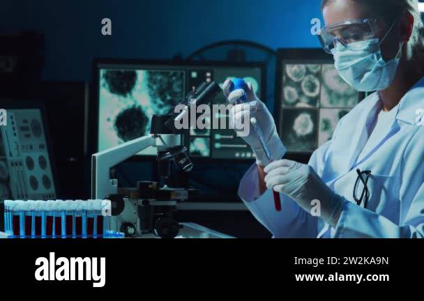 Scientist working in lab. Female doctor making medical research ...