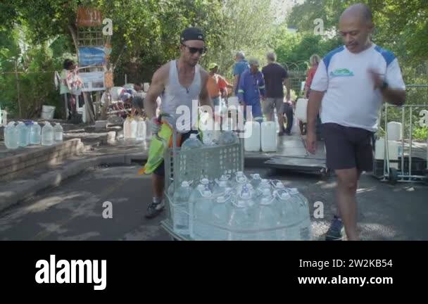 Capetonians collect water from a spring in South Africa during the ...