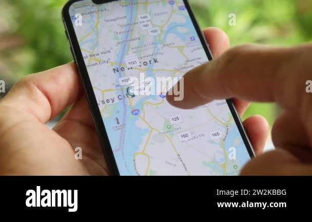 Man using navigation application with his phone and searching for ...