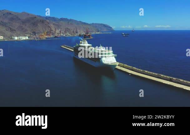 Aerial view of a sea cruise ship, a port and container terminal of ...
