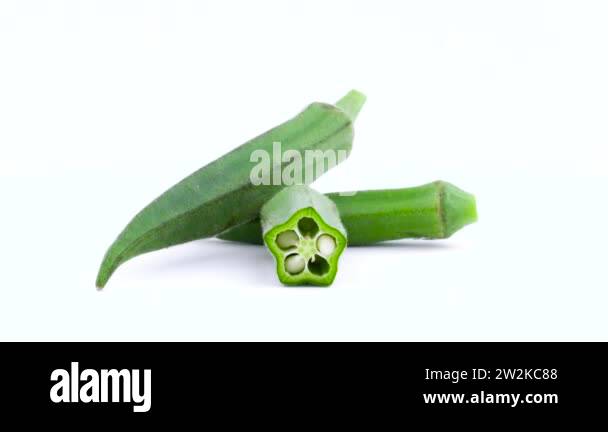 two whole and one half of green okra rotating Stock Video Footage - Alamy