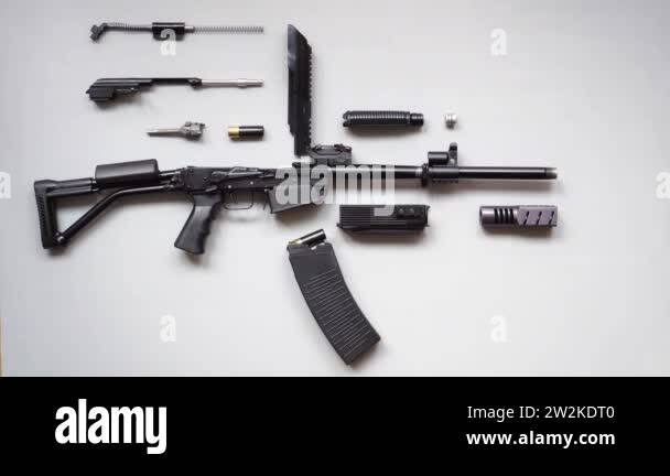 Disassembled machine gun on a gray background. Isolated. Details of ...