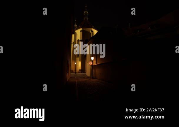 light from street lights in the old town and The Church of St. Hatal in ...