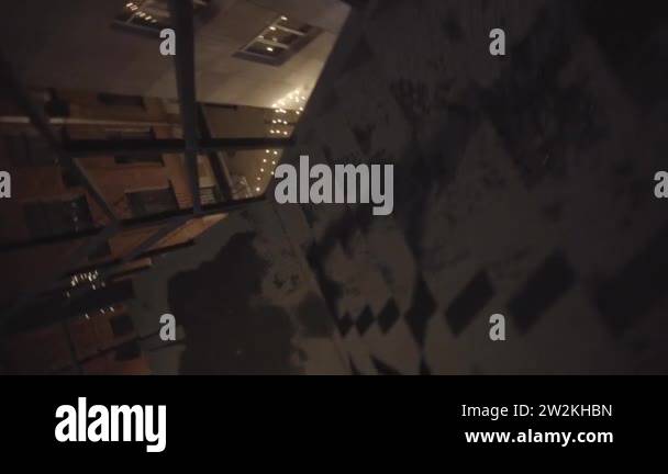 Going down the spiral iron stairs with camera rotating effect. Motion. Feeling of a drunk or ...