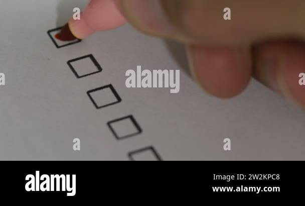 Person Ticks Checkbox Marks with a Pen, filling up To Do List. A person ...