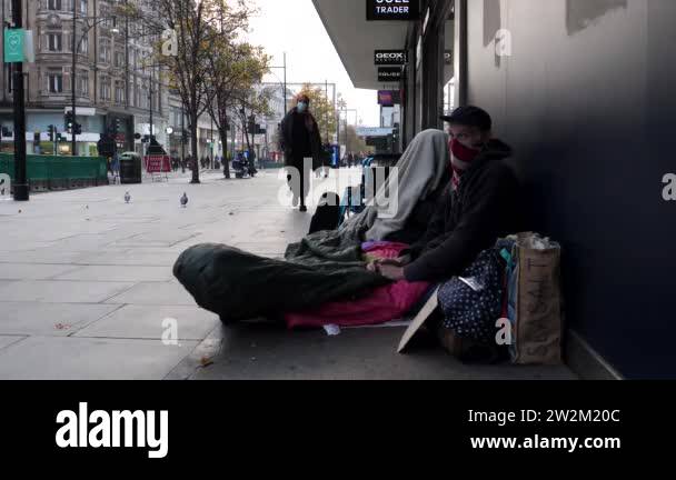 LONDON, ENGLAND, UNITED KINGDOM - CIRCA NOVEMBER, 2020: Two homeless ...