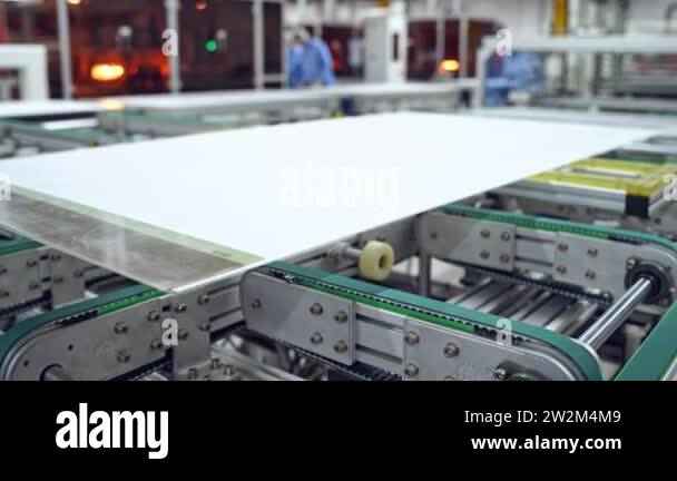 Process of making clean solar panels inside a modern factory. Automated ...