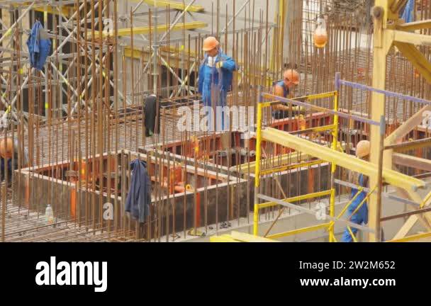 Reinforced concrete structure, construction process, people at the ...