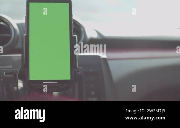 Phone on Car Dashboard Green Screen, Smartphone with a green screen is ...