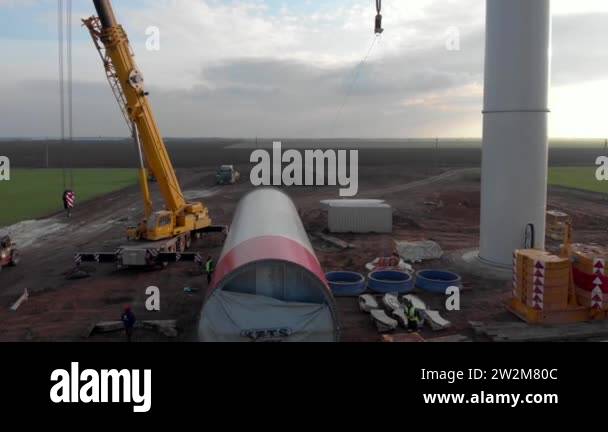 Building process of wind energy power tower, windmill under ...