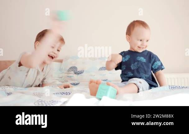 Two happy kids playing and learning. Small brothers having fun together ...