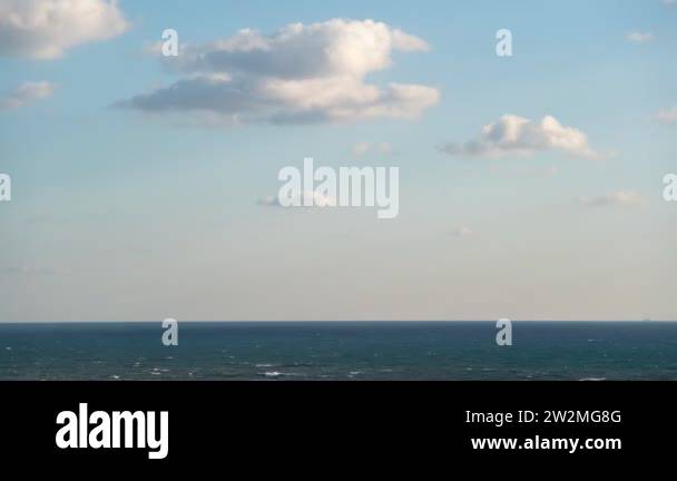 Seamless uhd time lapse of clouds on the sea that flow continuously in ...