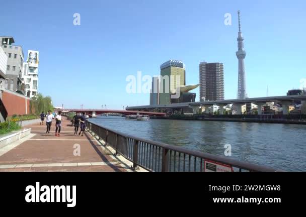 4K Tokyo Skytree building with japanese road runner running near the ...