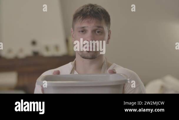 Close-up portrait of Caucasian man sighing as drops dropping from ...
