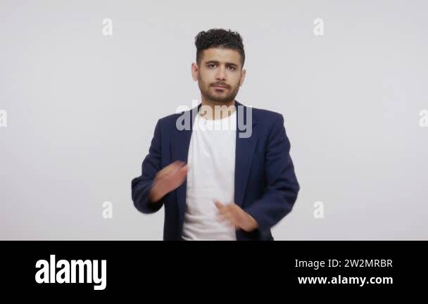 There is no way. Serious upset man with beard in elegant suit crossing ...