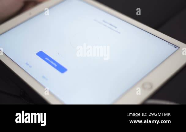 Sofia, Bulgaria-23 03 2020: Close up of Zoom app starting on iPad tablet. Zoom App logo and set ...