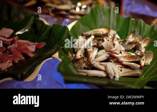 4K, fresh raw seafood in buffet line at Taiwan. Fish and crab legs on ...
