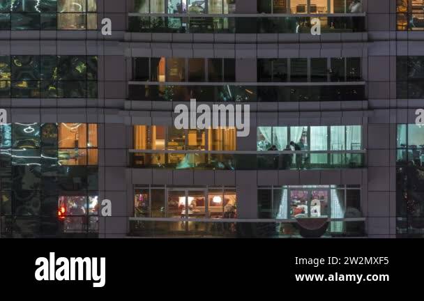 Night view of exterior apartment building timelapse. High rise ...