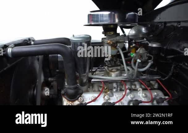 4K, Black vintage car engine under hood of a classic American Ford ...