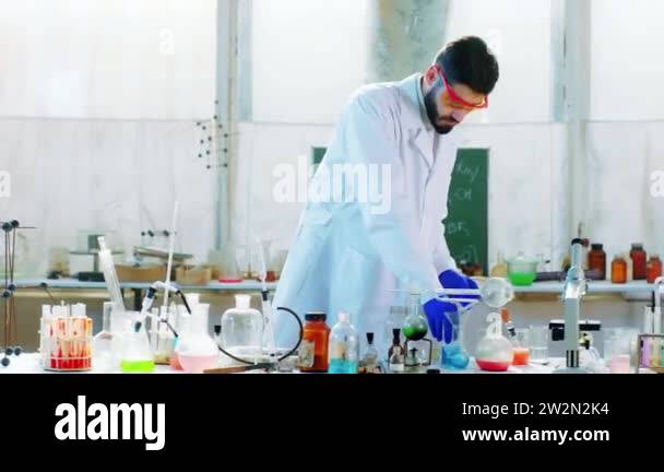 Medicines student man in the chemistry laboratory using some laboratory ...