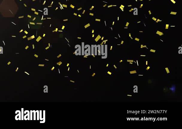 Animation of golden confetti falling with glowing yellow spotlight ...
