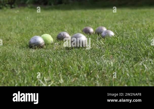 Exciting and nerve-racking game called Petanque. Almost metal balls are ...