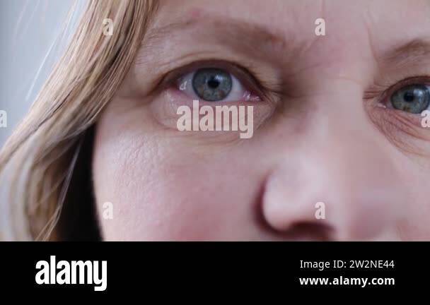 gray eye with spots on iris, wrinkles on eyelids close up, human vision ...