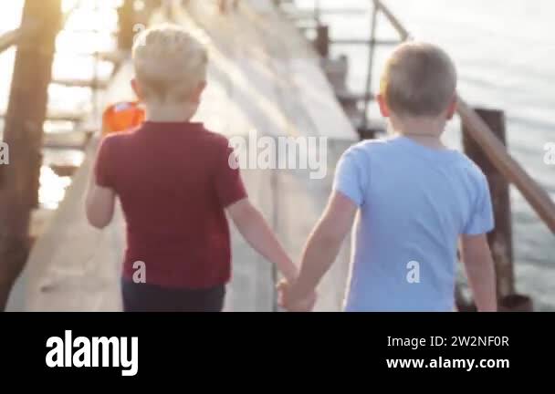 Two boys holding hands Stock Videos & Footage - HD and 4K Video Clips ...
