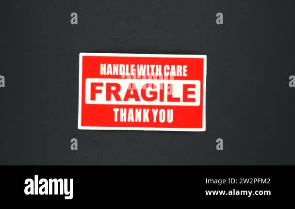 FRAGILE warning sign word text Stock Video Footage - Alamy