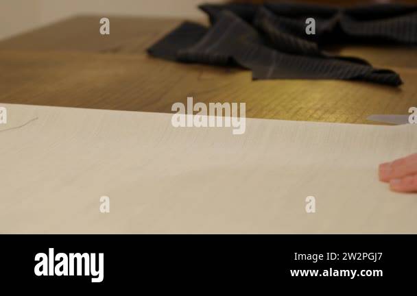 Sewing tools. Close-up: the scissors cuts the Pre Shrunk Coton Bump ...